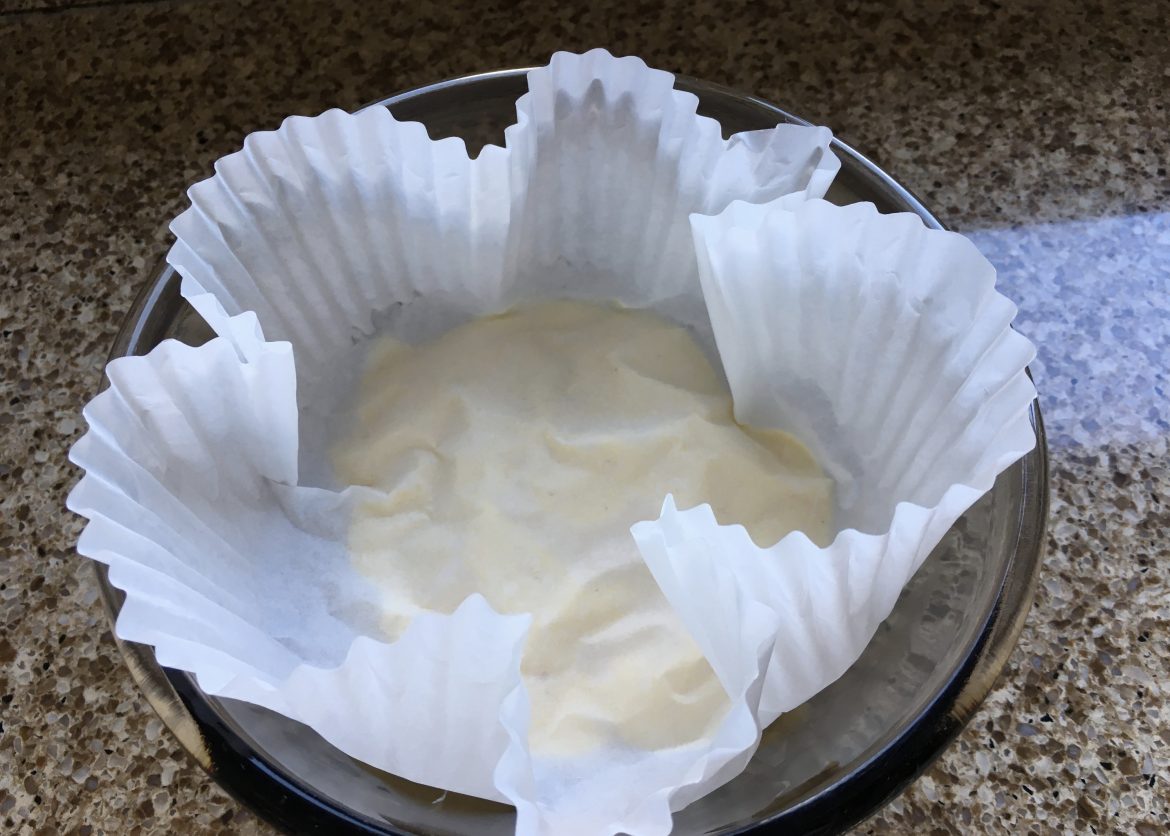 Custard filled pavlova topped with fresh strawberries and white ...